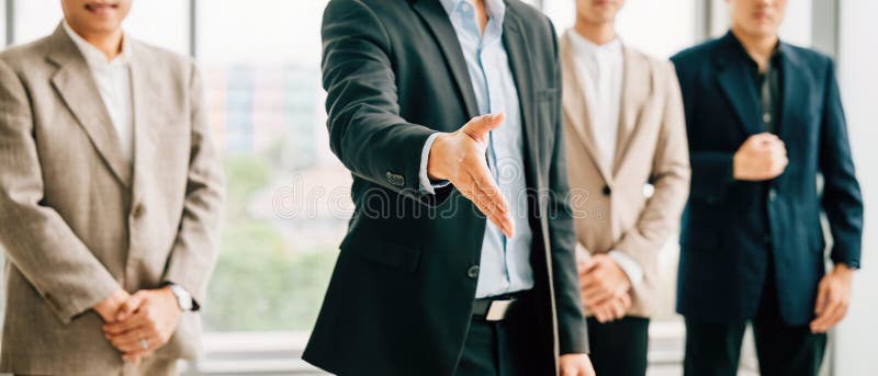 Businessman in Professional Suit Extends His Open Palm in Gesture of ...