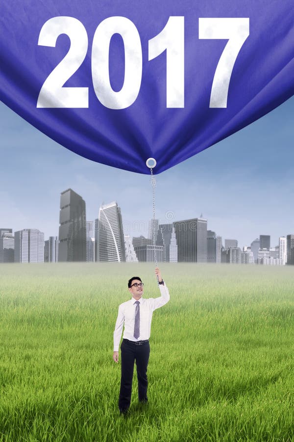 Businessman Pull Numbers 2017 at Field Stock Image - Image of blue ...
