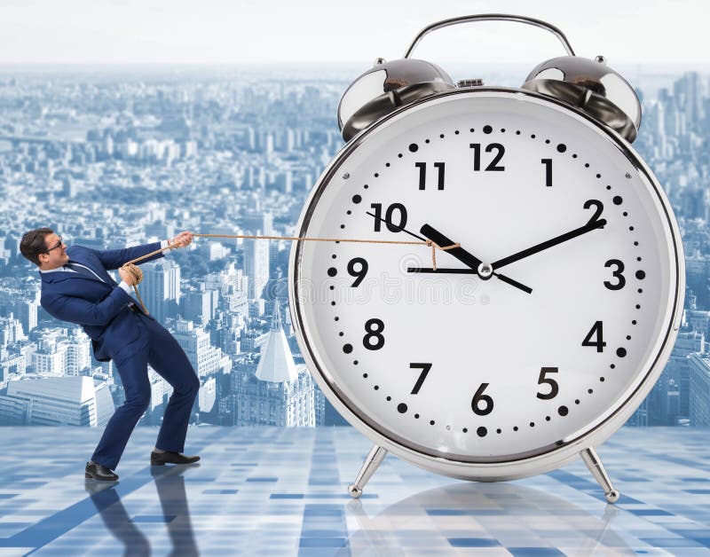 Businessman Pulling Clock in Time Management Concept Stock Photo ...