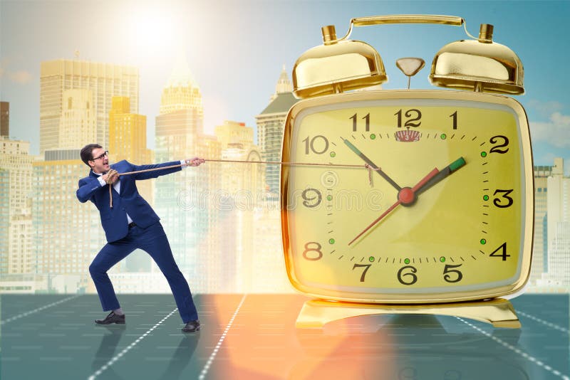The Businessman Pulling Clock in Time Management Concept Stock Photo ...