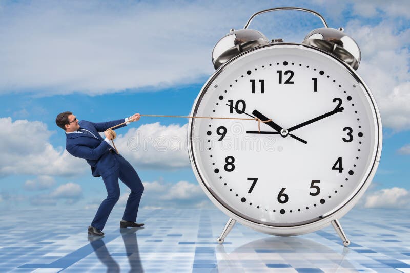 The Businessman Pulling Clock in Time Management Concept Stock Image ...