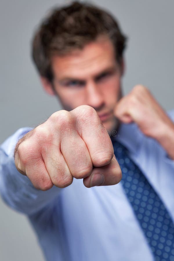 Businessman Punching Towards Camera Stock Photo - Image of frustration ...