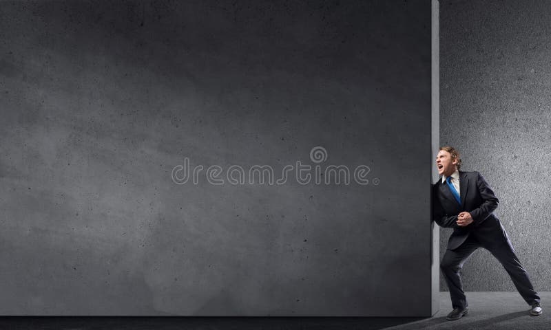 Businessman push wall stock image. Image of male, executive - 87772921