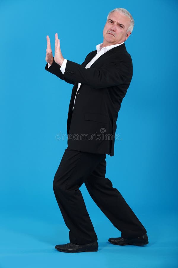 Businessman Pushing Against Something Stock Image - Image of modern ...