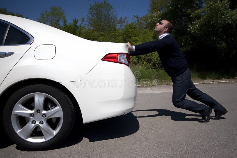 Man pushing his car stock photo. Image of gasoline, breakdown - 6028834 Man pushing his car stock photo. Image of gasoline, breakdown - 6028834