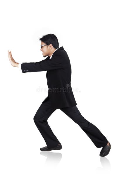 Businessman Pushing Something Heavy Pose Stock Photo - Image of ...