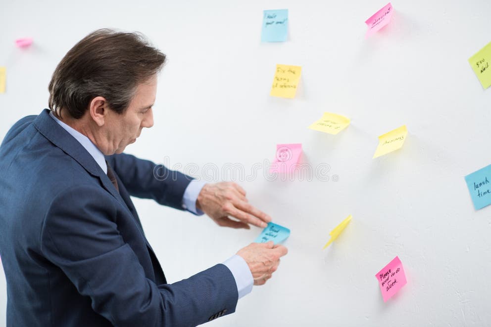 Businessman Putting Sticker on Board Stock Photo - Image of european ...
