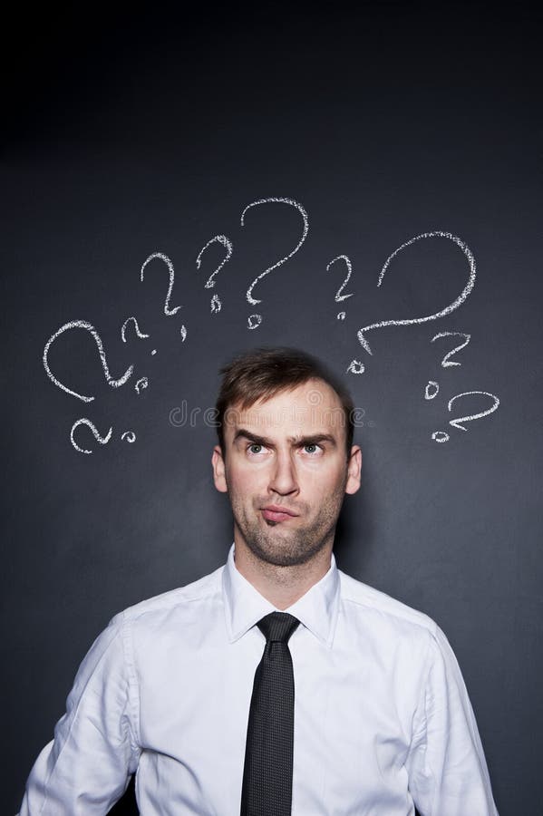 Thinking Business Man with Chalk Questions What Why when Where Who and ...