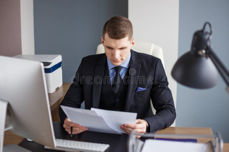 Businessman Reading Contract in Office Stock Image - Image of paperwork ... Businessman Reading Contract in Office Stock Image - Image of paperwork ...