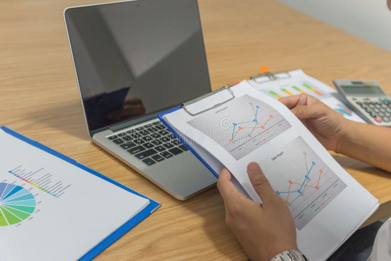 Businessman Reading Data in Chart Stock Image - Image of office, adult ...
