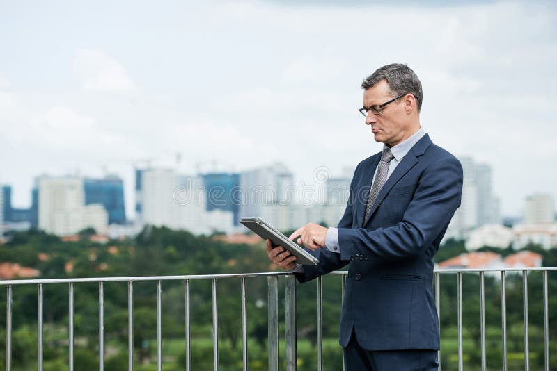 Businessman Reading Data on Tablet Stock Image - Image of email ...