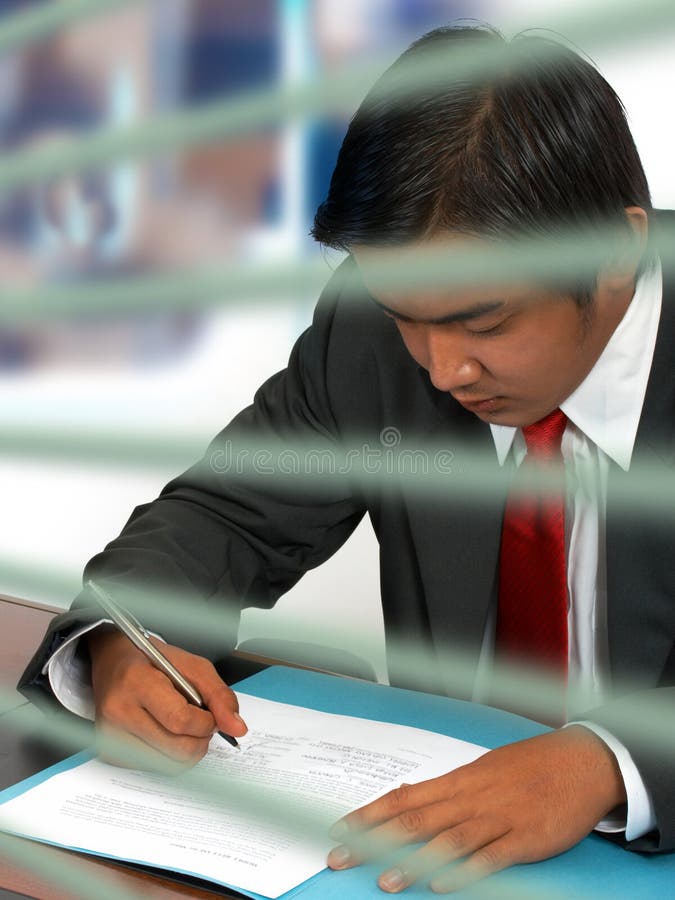 Businessman Reading a Document Stock Image - Image of sitting ...