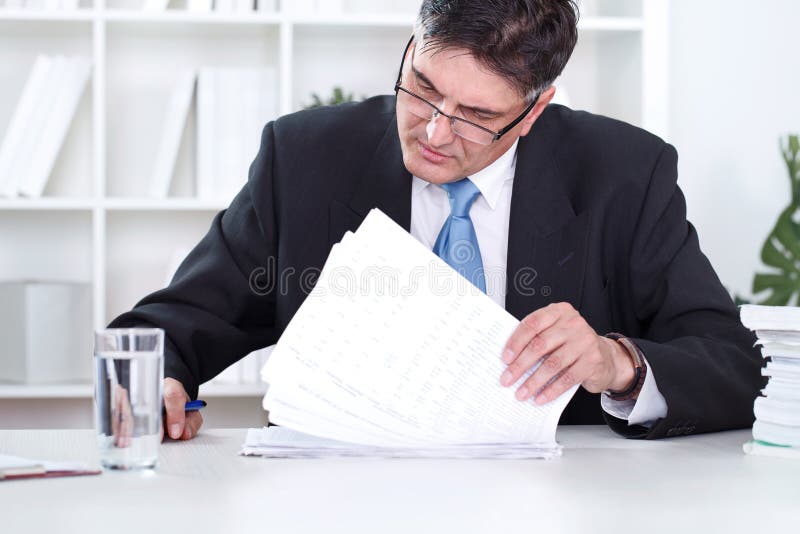 Businessman Reading Documents Stock Photo - Image of boss, leadership ...