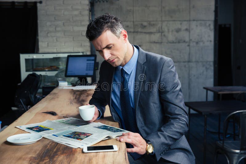 Businessman Reading Magazine in Cafe Stock Photo - Image of morning ...
