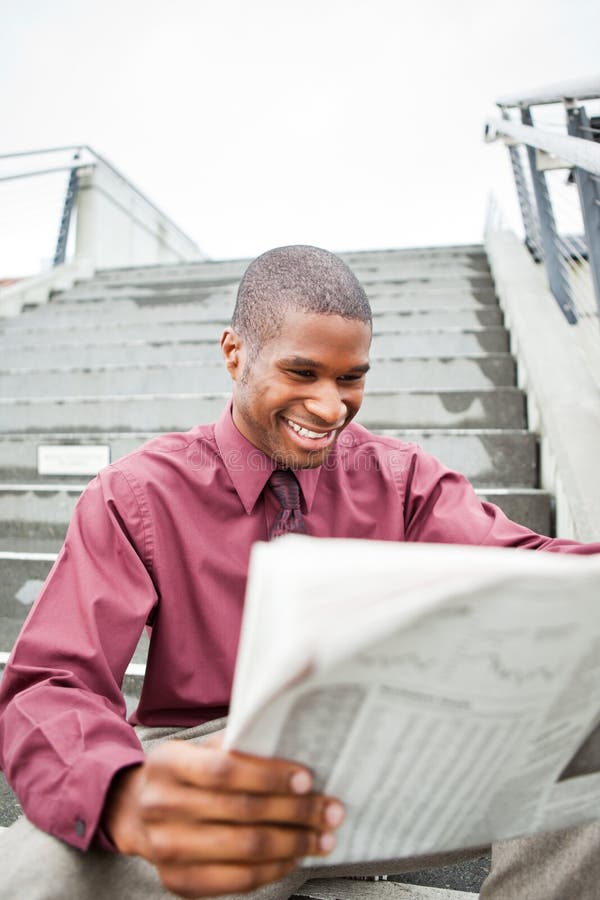 Guy reading newspaper stock image. Image of business - 33656799