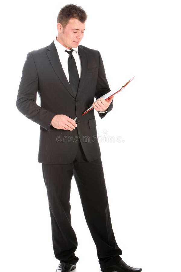 Young Man Reading Notes on a Clipboard Stock Image - Image of looking ...