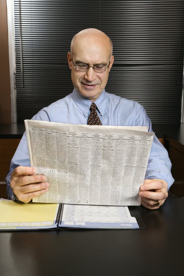 Businessman Reading Blueprint. Stock Image - Image of male, person: 5034279