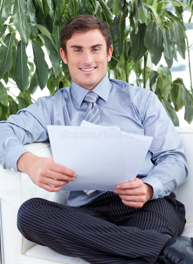 Businessman Reading Papers and Smiling Stock Image - Image of happy ...