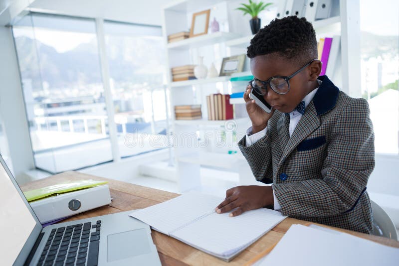 Businessman Reading Report while Talking on Phone Stock Photo - Image ...