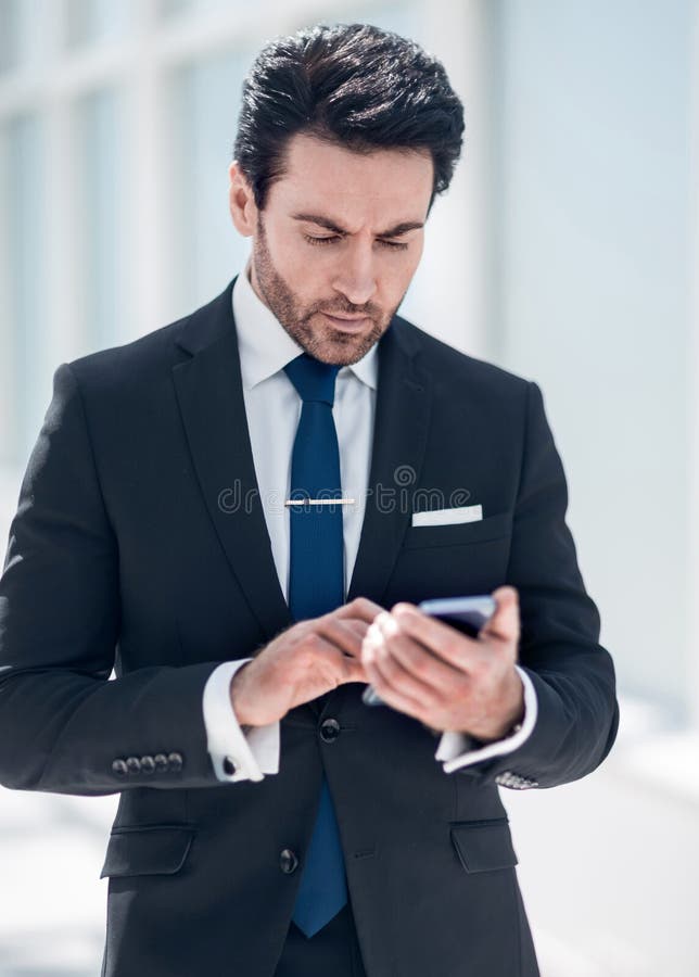 Businessman Reading Text Message on Smartphone. Stock Image - Image of ...