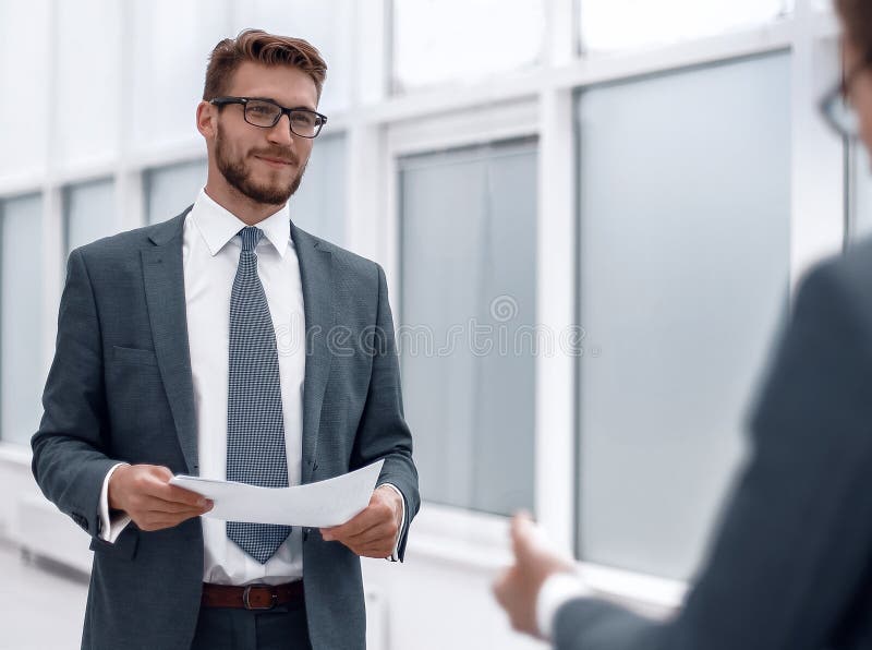 Businessman Reading a Working Paper Standing in the Office Stock Image ...