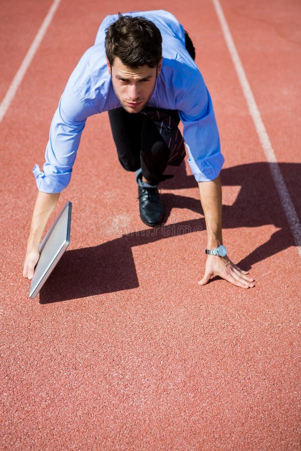 Businessman ready to run stock image. Image of concentration - 77657235