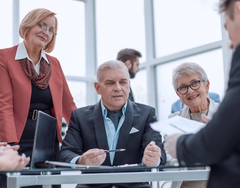 Businessman Receiving Documents from Hands of Partner Stock Photo ...