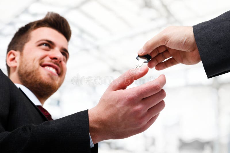 Businessman Receiving a Key Stock Image - Image of businessman, agent ...