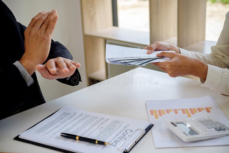 Businessman Refusing Money in the Envelope To Agreement Contract Stock ...