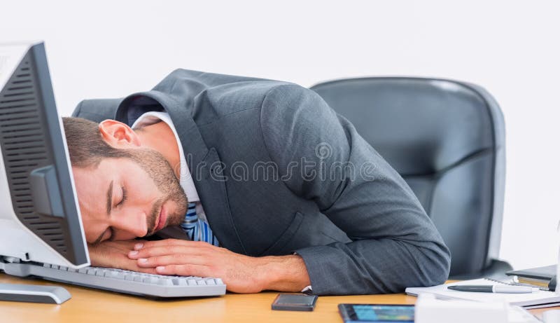 Businessman Resting with Head Over Keyboard at Desk Stock Photo - Image ...