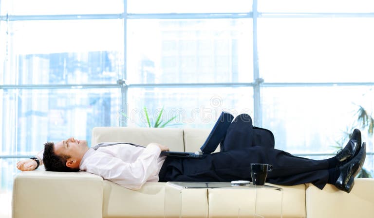 Businessman Resting on Sofa Stock Image - Image of businessperson ...