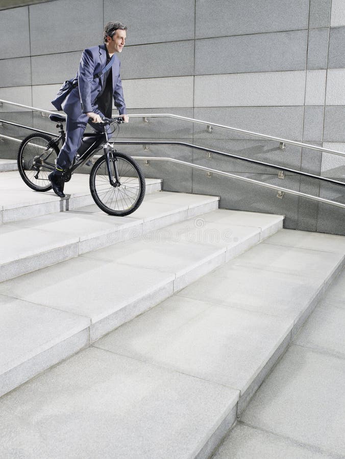 Businessman Riding Bicycle Down Steps Stock Image - Image of full ...
