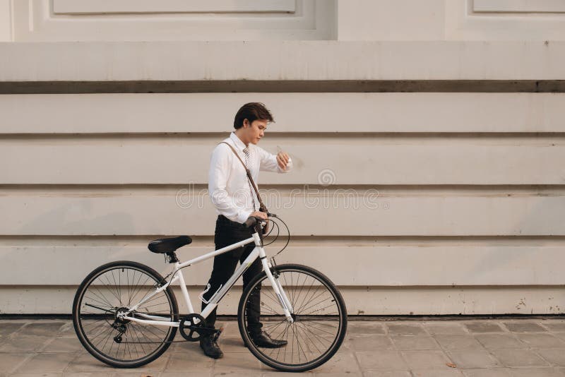 Businessman Riding Bicycle To Work in Town Stock Photo - Image of ...