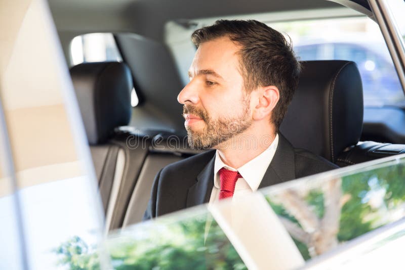 Businessman Riding a Taxi for Work Stock Photo - Image of lifestyle ...