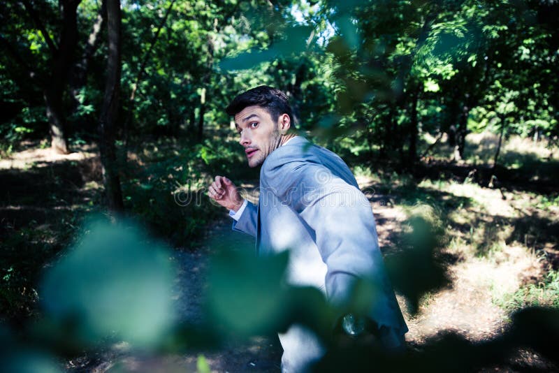 Businessman Running Away from Something Stock Photo - Image of running ...