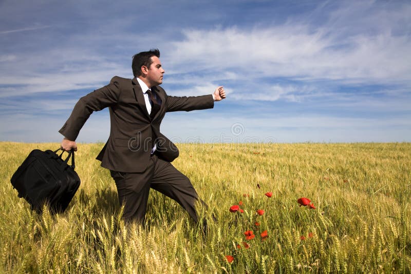 Businessman Running in a Field Stock Image - Image of field, relaxation ...