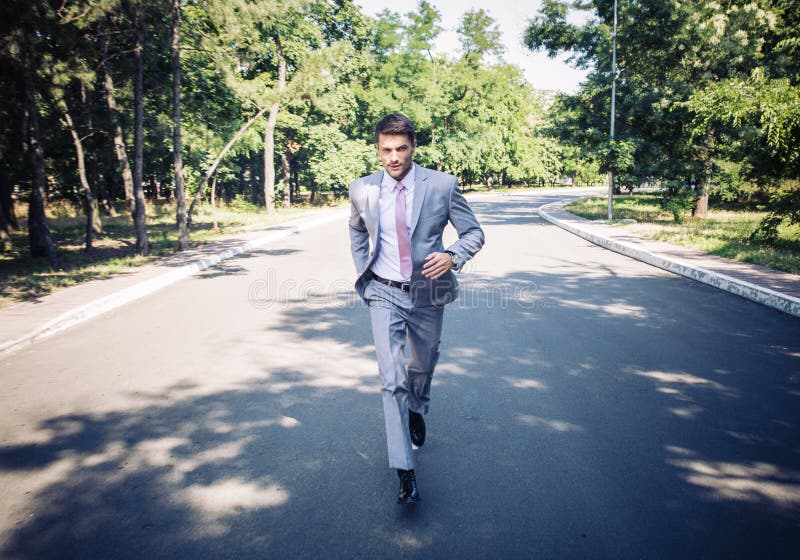 157 Man Suit Running Fast Road Stock Photos - Free & Royalty-Free Stock ...