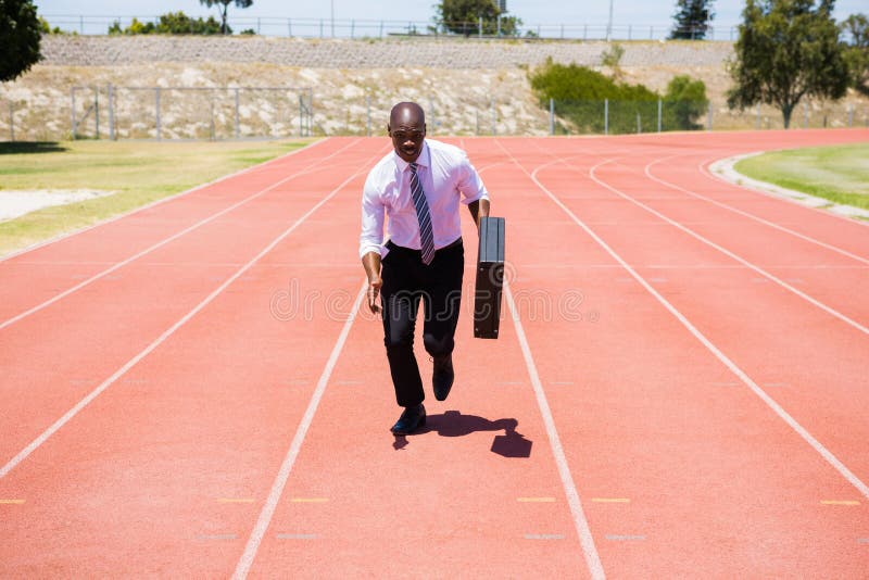 Businessman Running on a Running Track Stock Image - Image of beginning ...