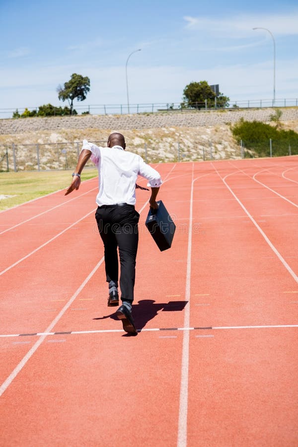 Businessman Running on a Running Track Stock Image - Image of person ...