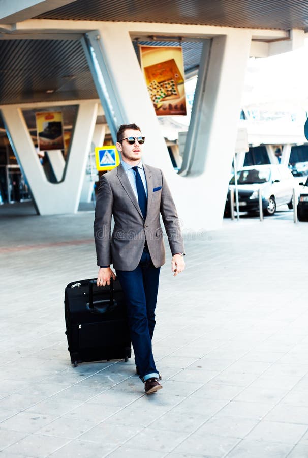 Businessman Rushing in Airport Stock Image - Image of quickly, late ...