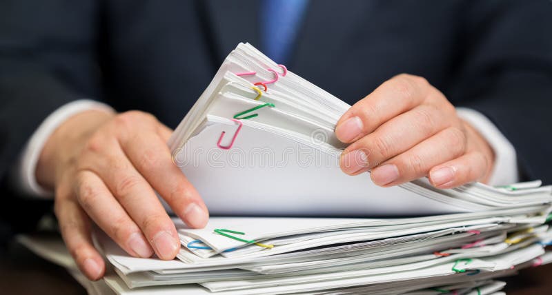Businessman`s Hand Holding a Bundle of Papers Stock Image - Image of ...