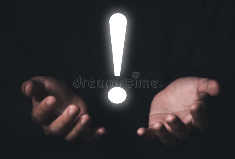 The Businessman S Hand Shows a White Exclamation Mark. Stock ...