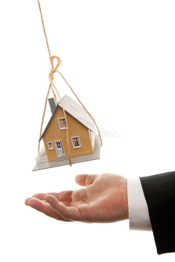 Businessman S Hand Under Dangling House Stock Photo - Image of ...