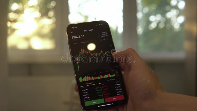 Businessman Scrolling on His Phone Chart of BTC Cryptocurrency Value ...