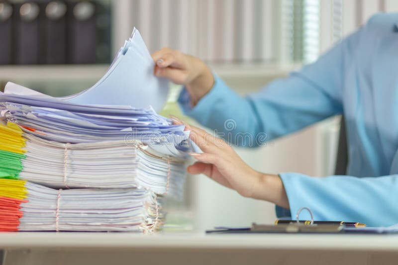 Businessman Searching for Important Contract Documents from Pile of ...