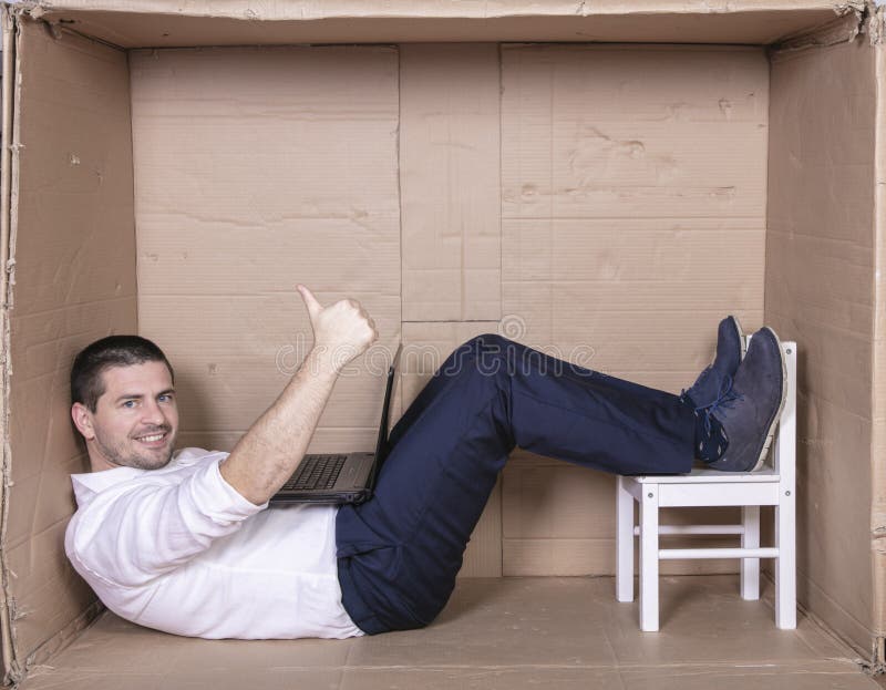 Businessman Seated in His Cramped Office Satisfied with His Work Stock ...