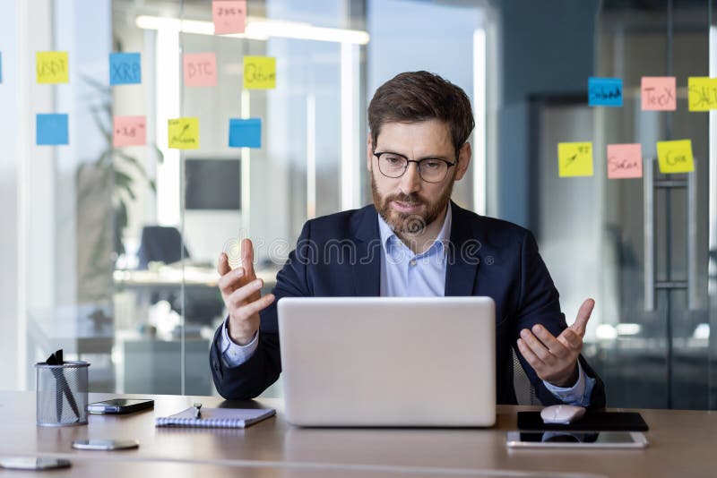 Businessman Serious Talking during Virtual Meeting in Modern Office ...