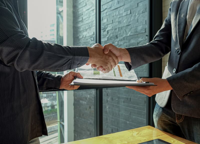 Businessman Shakehand and Exchanging Contract Documents Stock Image ...