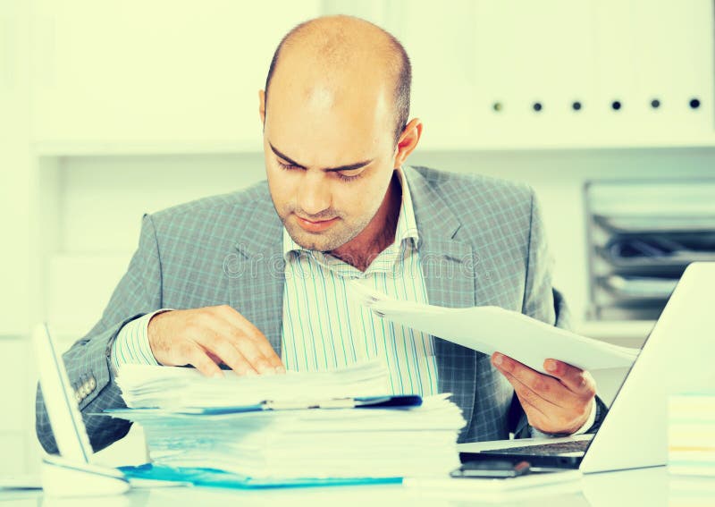 Businessman in Shirt Viewing Documents at the Table Stock Photo - Image ...