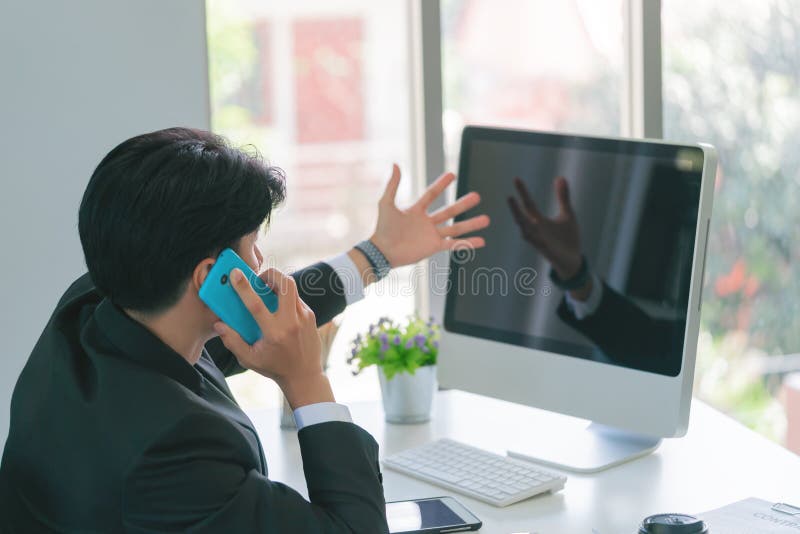 Businessman Shouting on the Mobile while Looking at Blank Computer ...